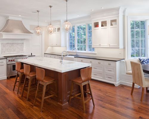 Example Of A Classic L Shaped Kitchen Design With A Farmhouse Sink ...